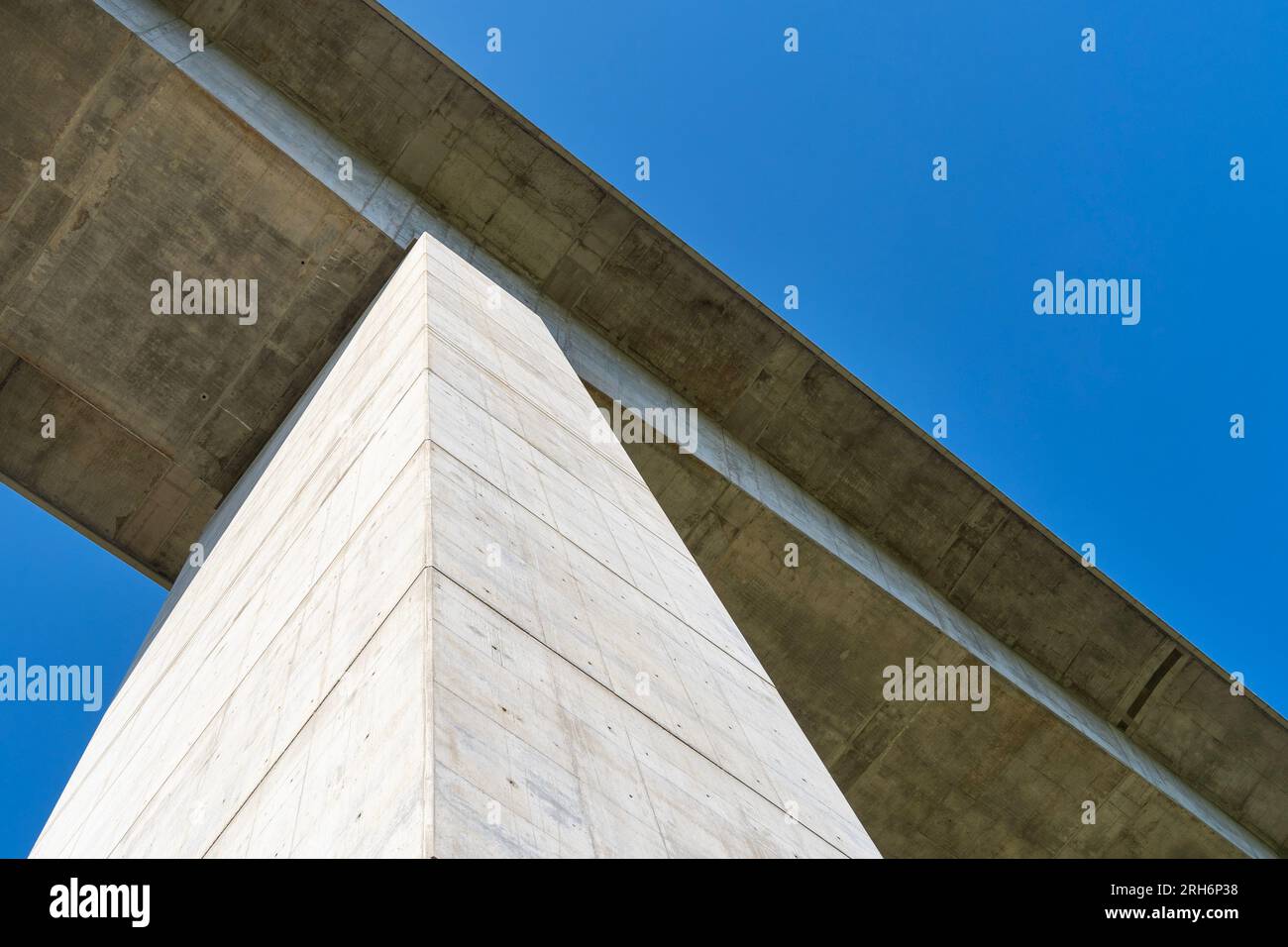 Gray supporting concrete column of Koroshegy valley bridge. Next to ...