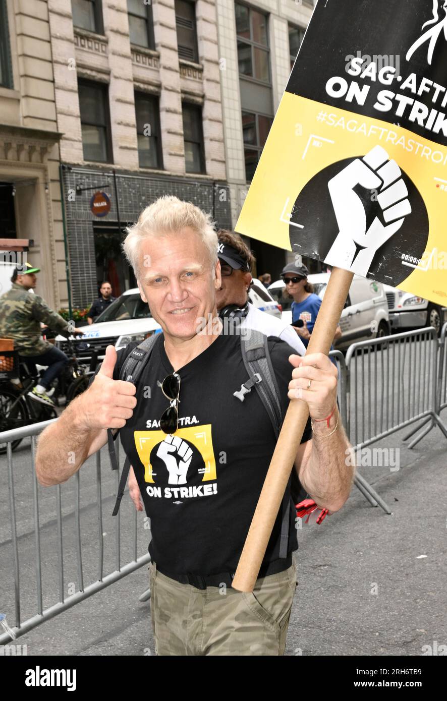 Terry Serpico carries a sign on the picket line outside Netflix on ...