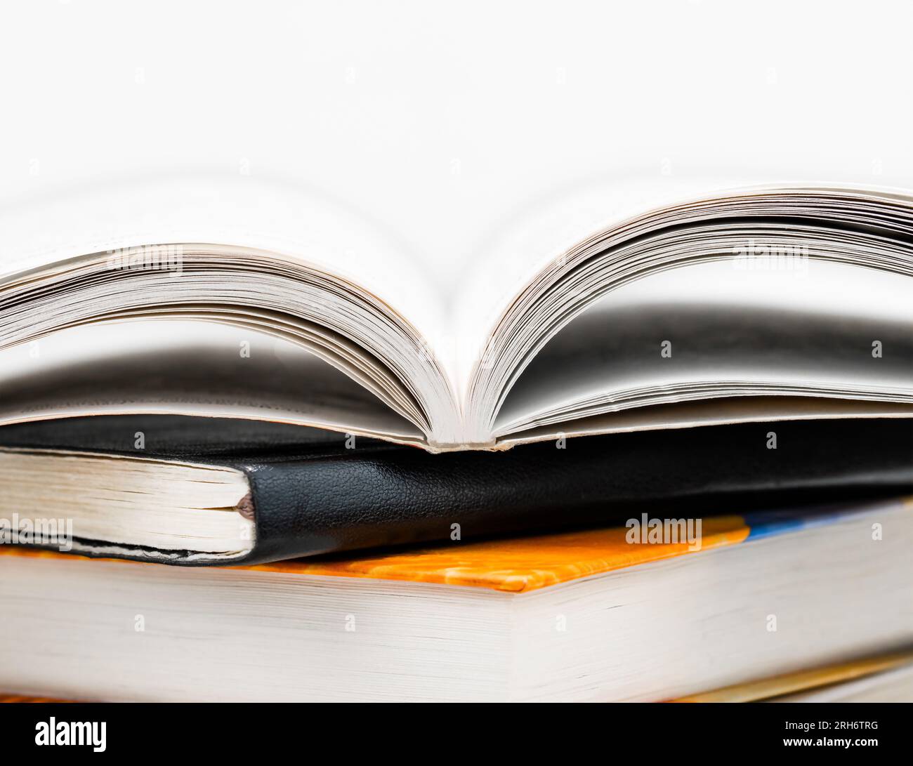 Open book on a stack close up. Business and education concept Stock ...