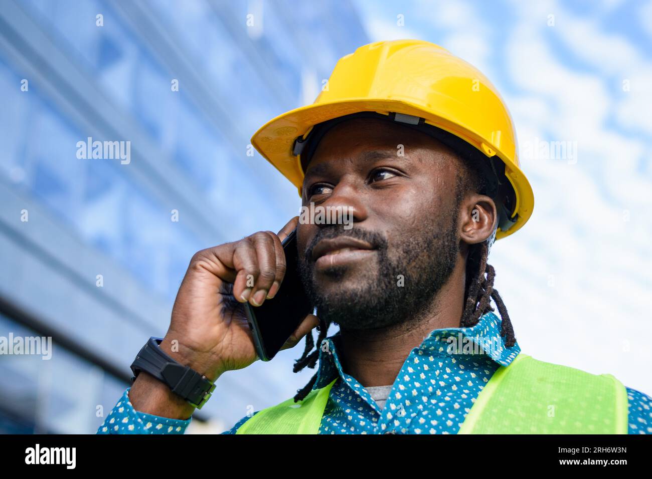 African ethnicity civil engineer man with dreadlocks and beard, wears ...