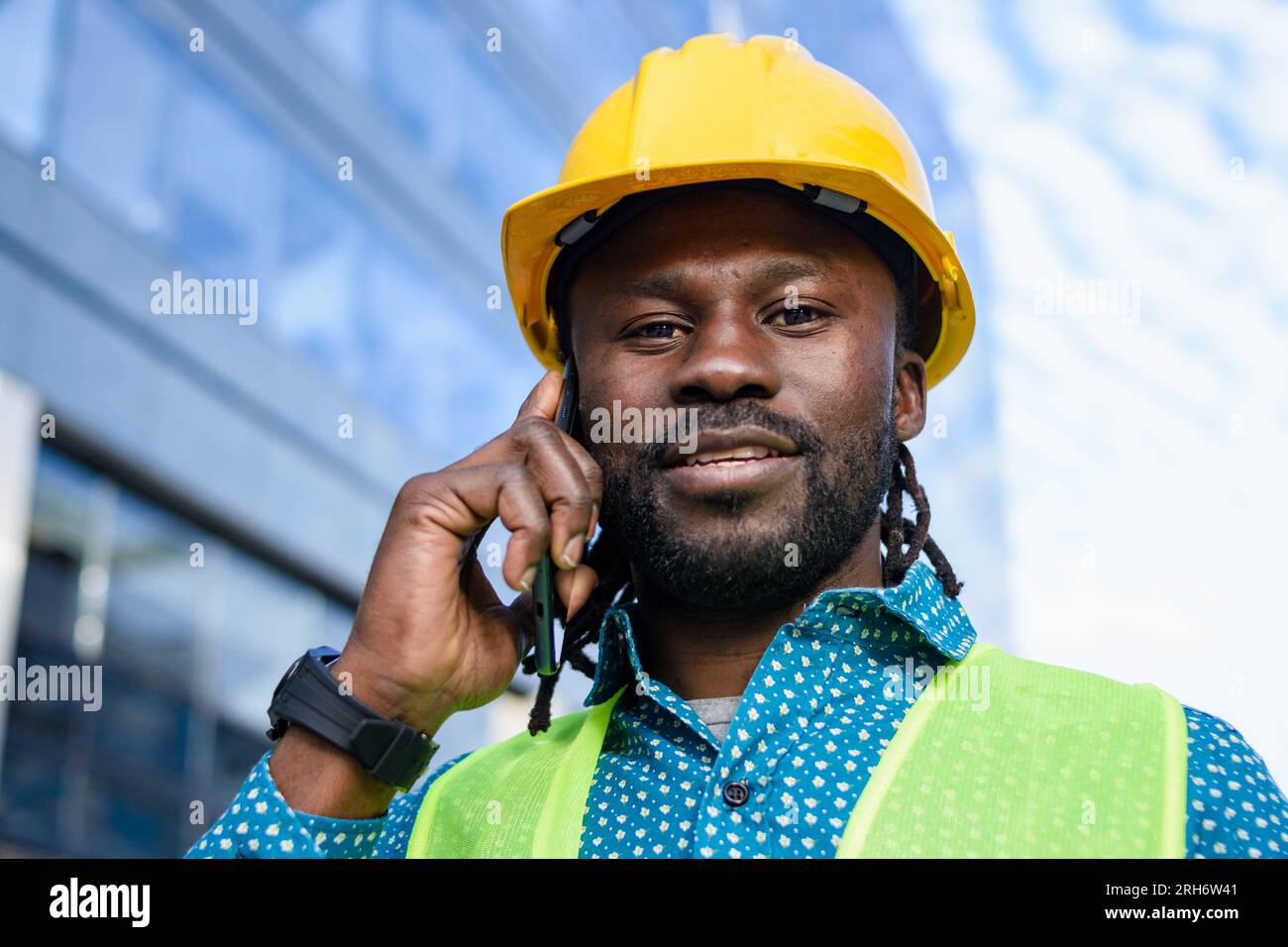 African ethnicity civil engineer man with dreadlocks and beard, wears ...