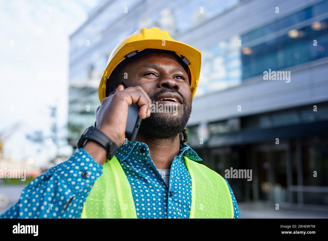 African ethnicity civil engineer man with dreadlocks and beard, wears ...