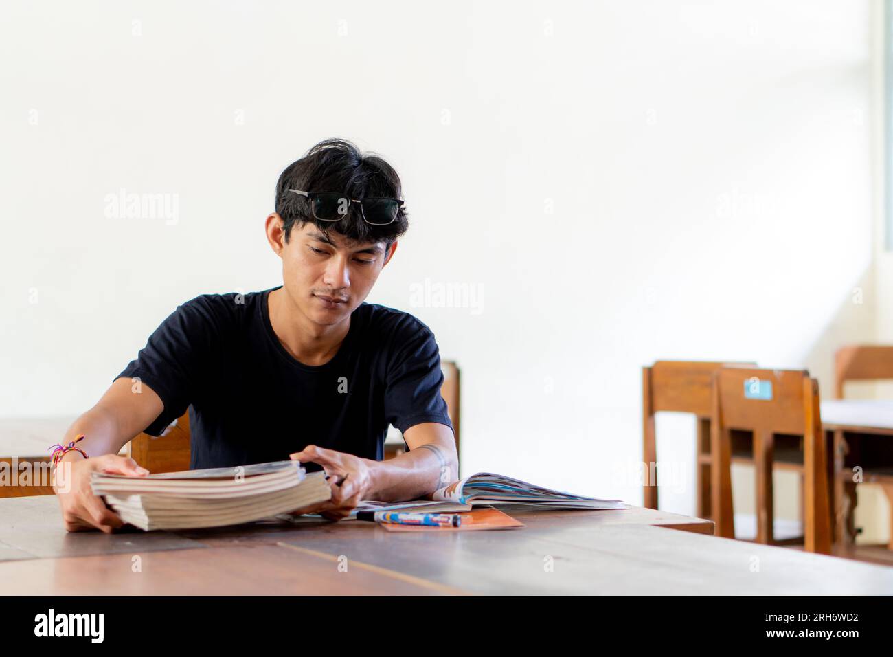 Overworked and tired high school student man studying feeling depressed ...