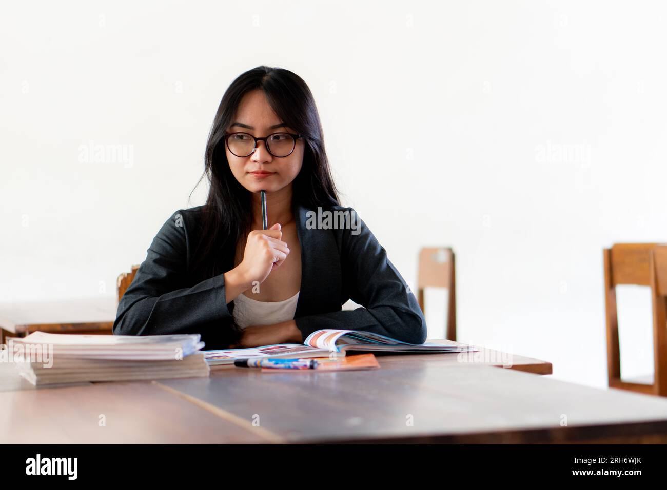 Young female student study in the school library. white background ...