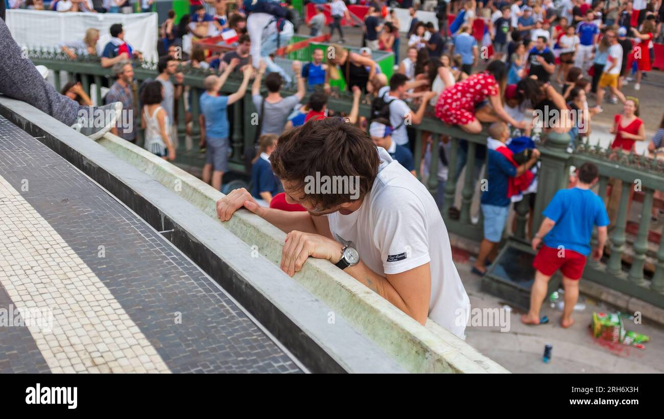 Paris, France, 2018. A man hoisting himself up the July Column, Place ...