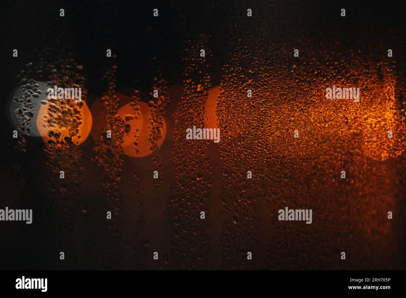 Wet glass after the rain with blurry lights. Abstract background Stock ...