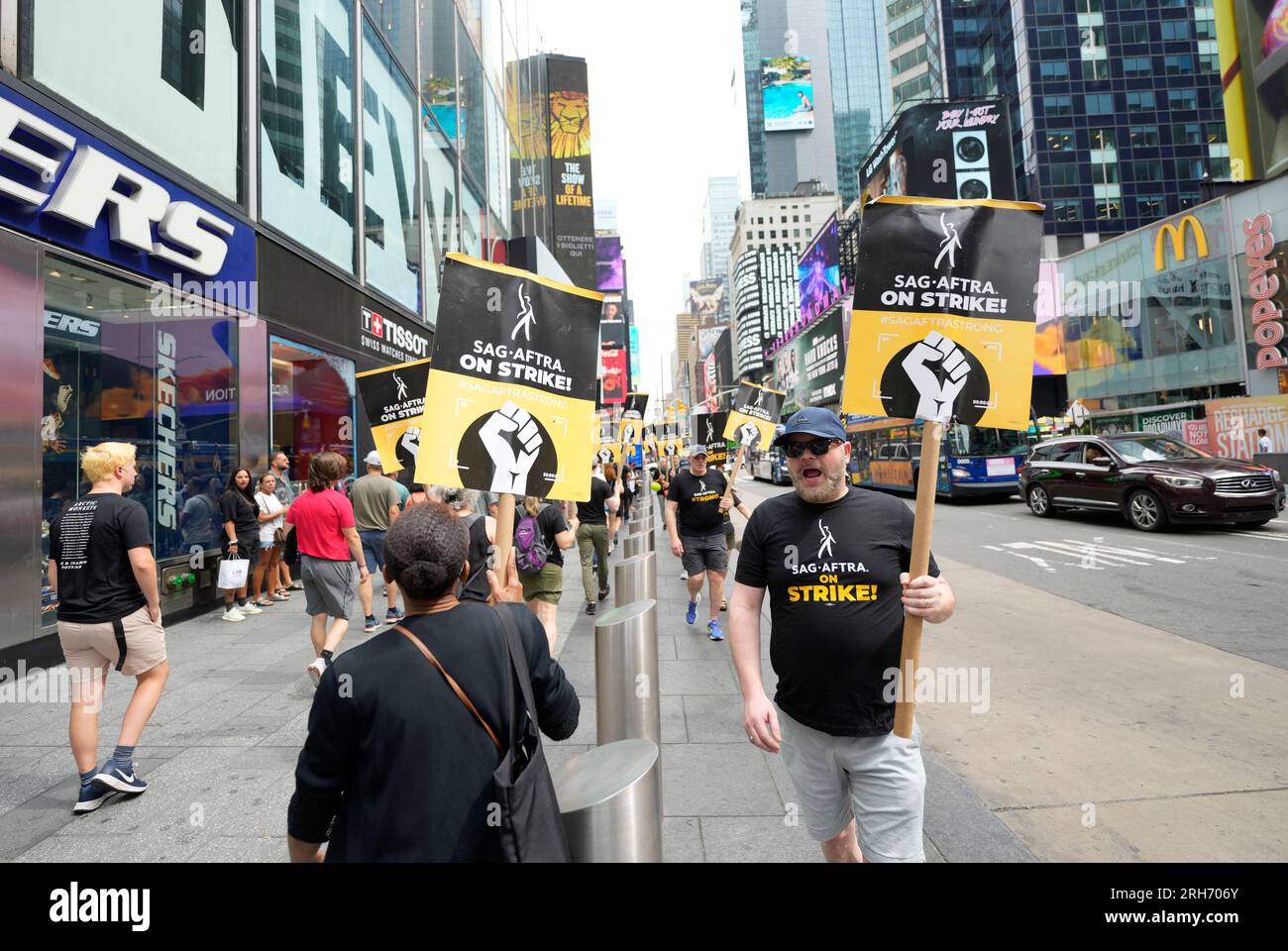 Picketers carry signs on the picket line outside Paramount in Times ...