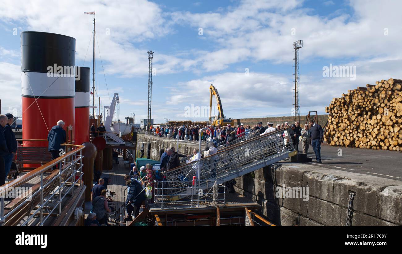 people queue to board the Paddle Steamer Waverley in Troon harbour for ...