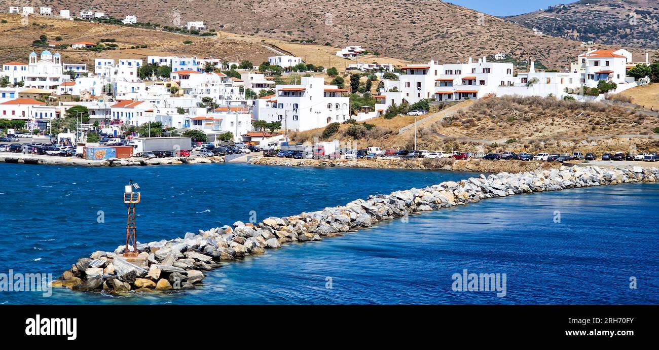 The jetty seen from a ferry-boat leaving Tinos harbor, Greece, Southern ...