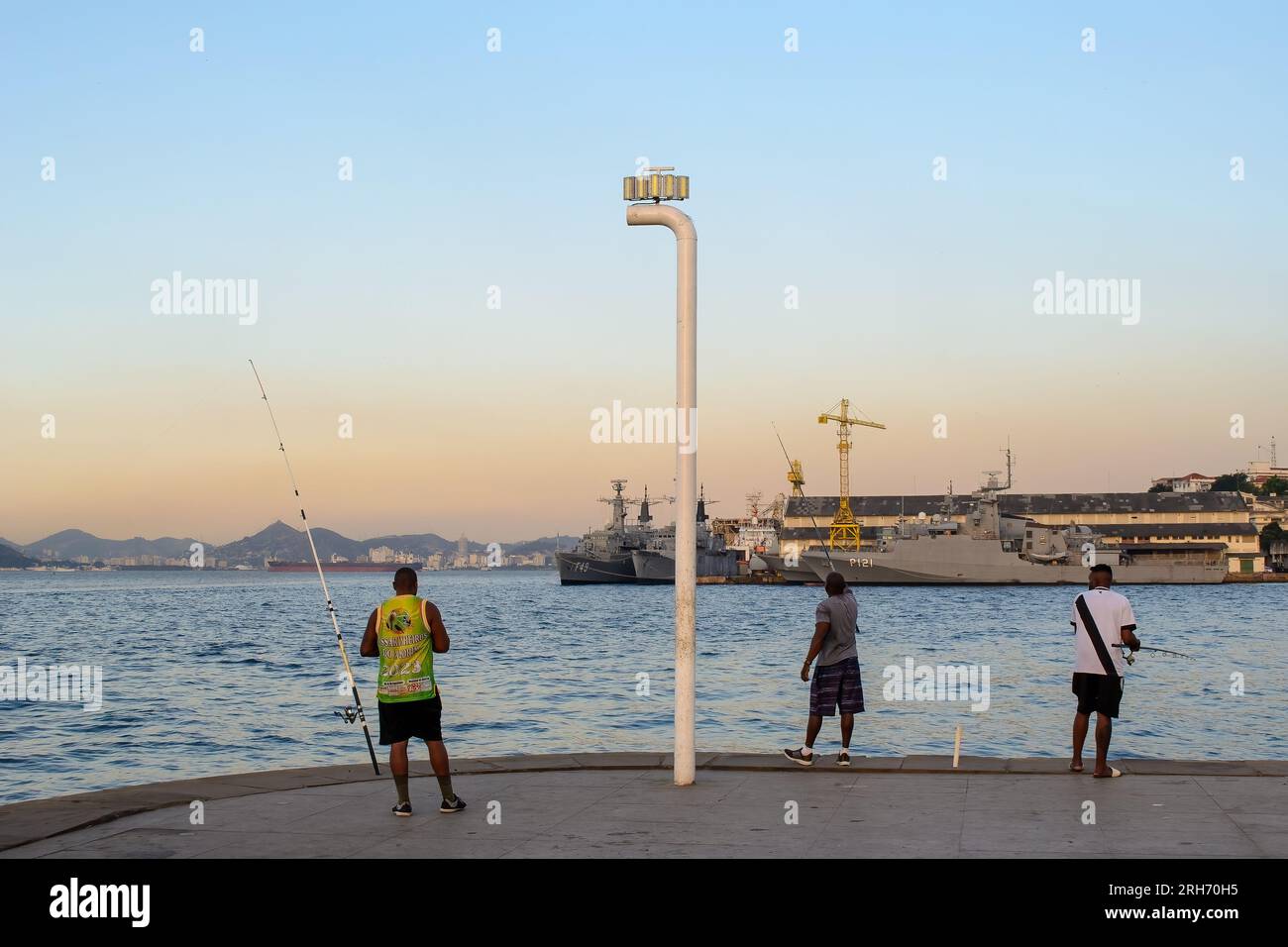 Rio de Janeiro, Brazil, Brazilian men fishing in the waterfront ...