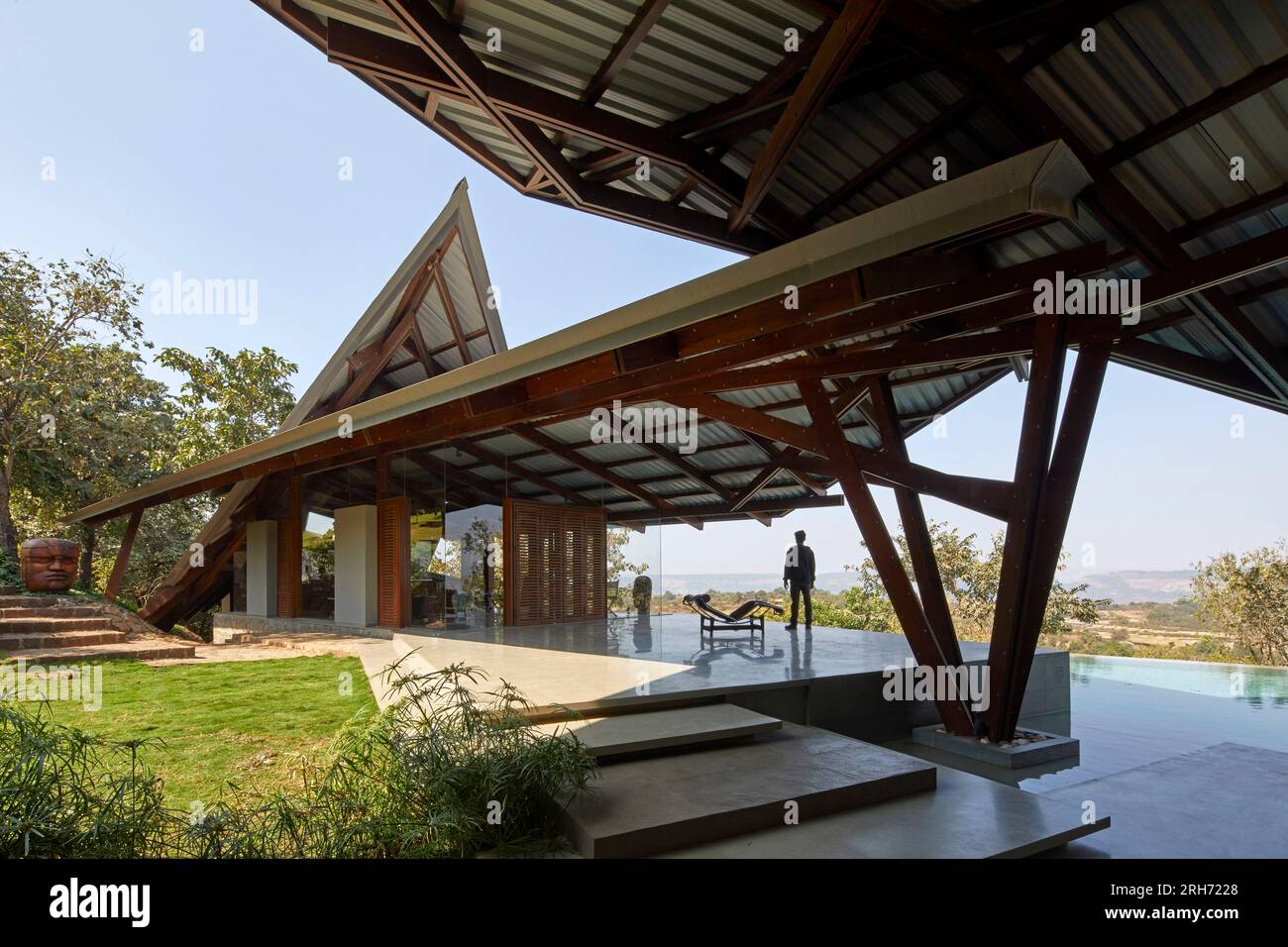 Exterior view of new wing. Retreat in the Western Ghats, Maharashtra, India. Architect: Malik ...