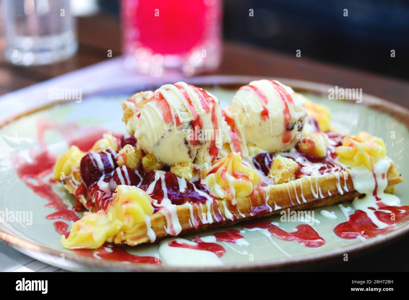 Wholegrain flour crusty belgian waffle with a scoop of ice cream and ...