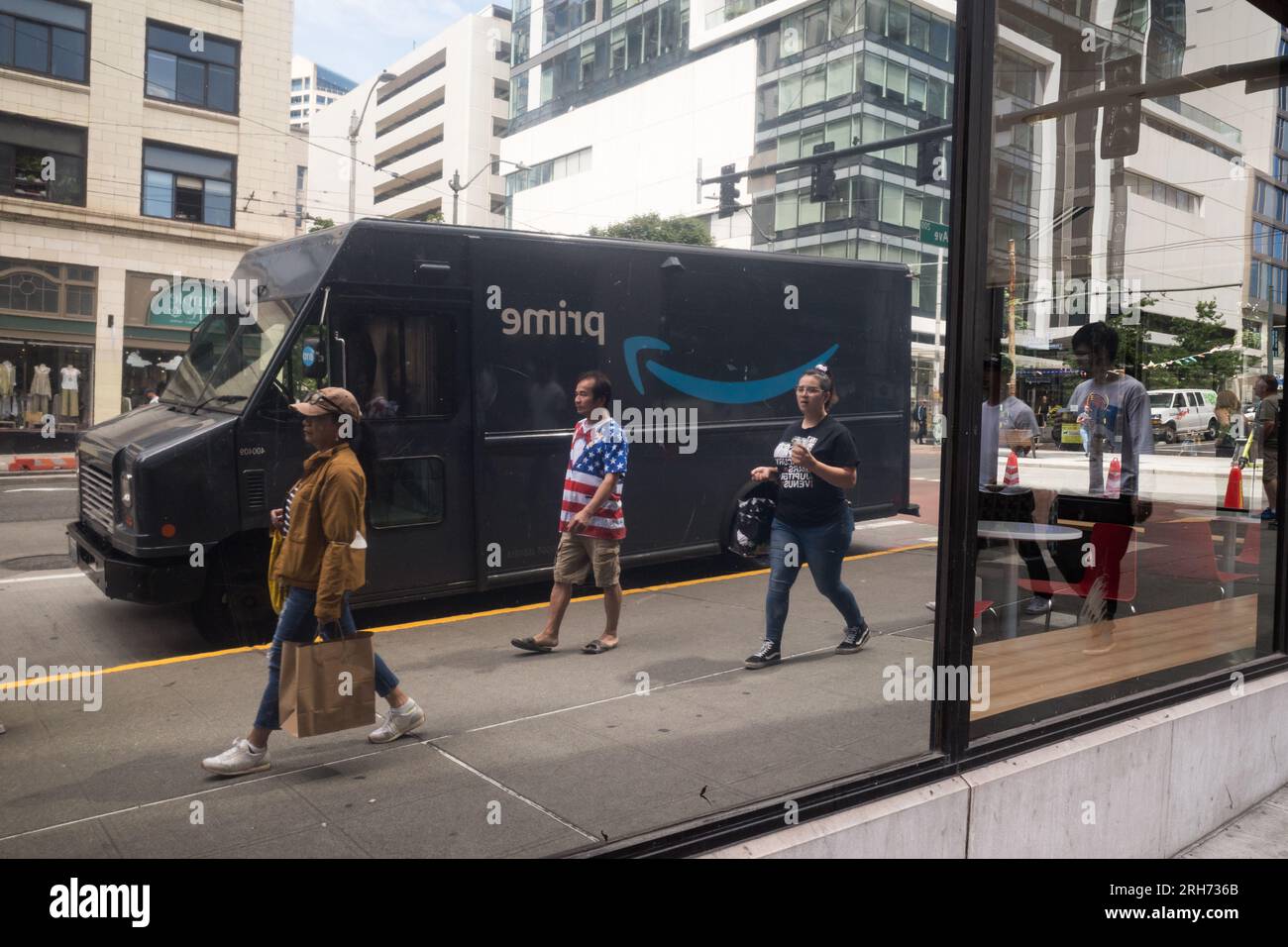 Seattle, USA. 8 Aug, 2023. Amazon delivery truck in downtown reflected ...