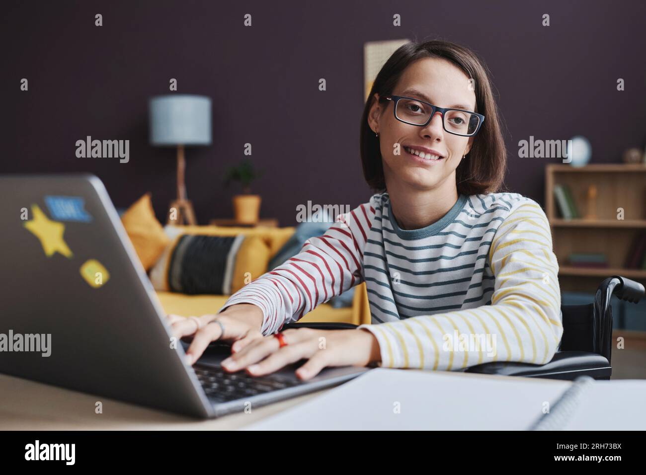Child wheelchair using laptop hi-res stock photography and images - Alamy
