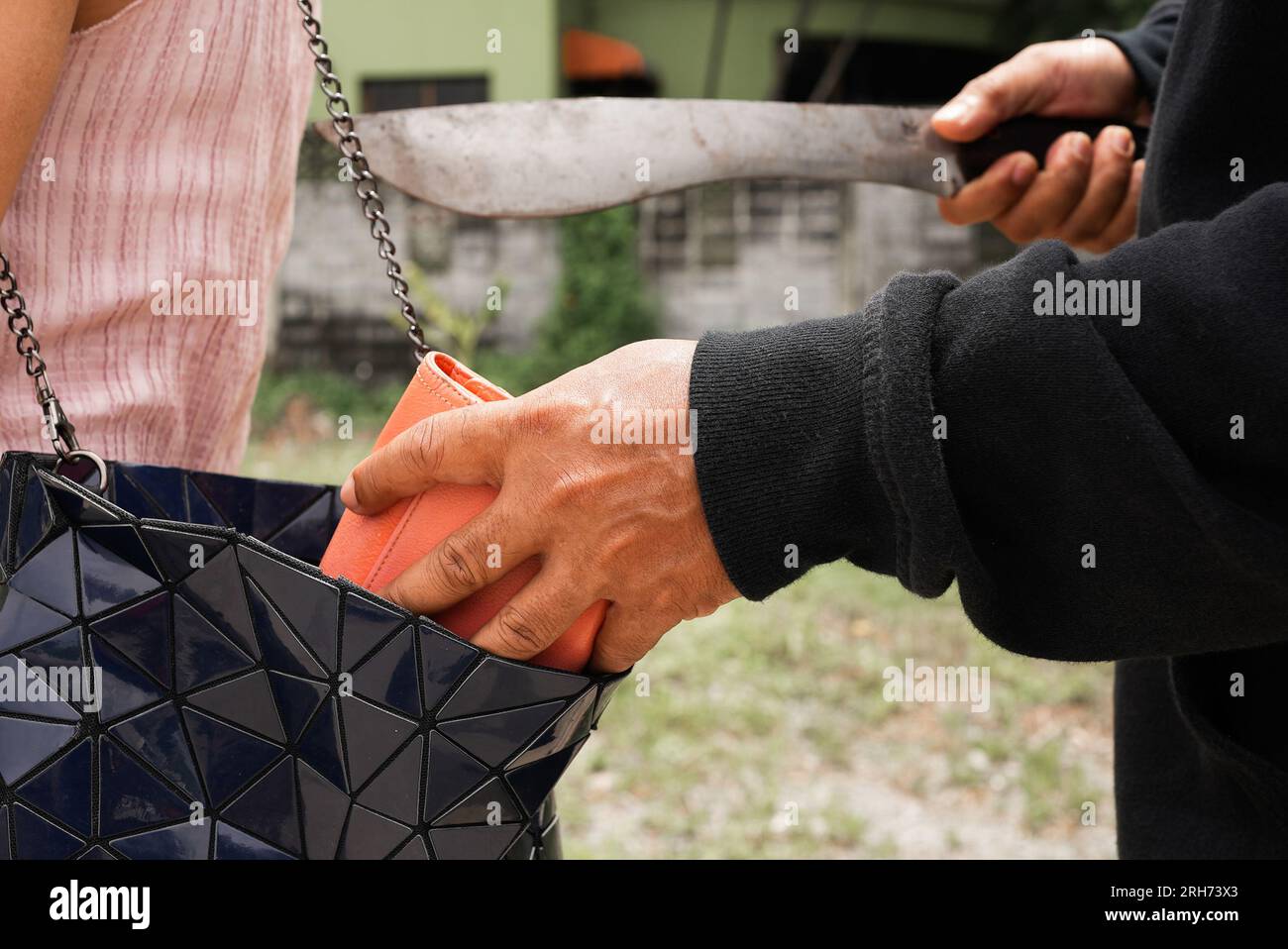 Man robbed woman, Thief stealing in public Stock Photo - Alamy