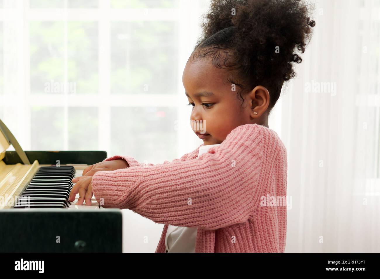 Kid playing piano, Daughter in piano class, Happy kid playing piano ...