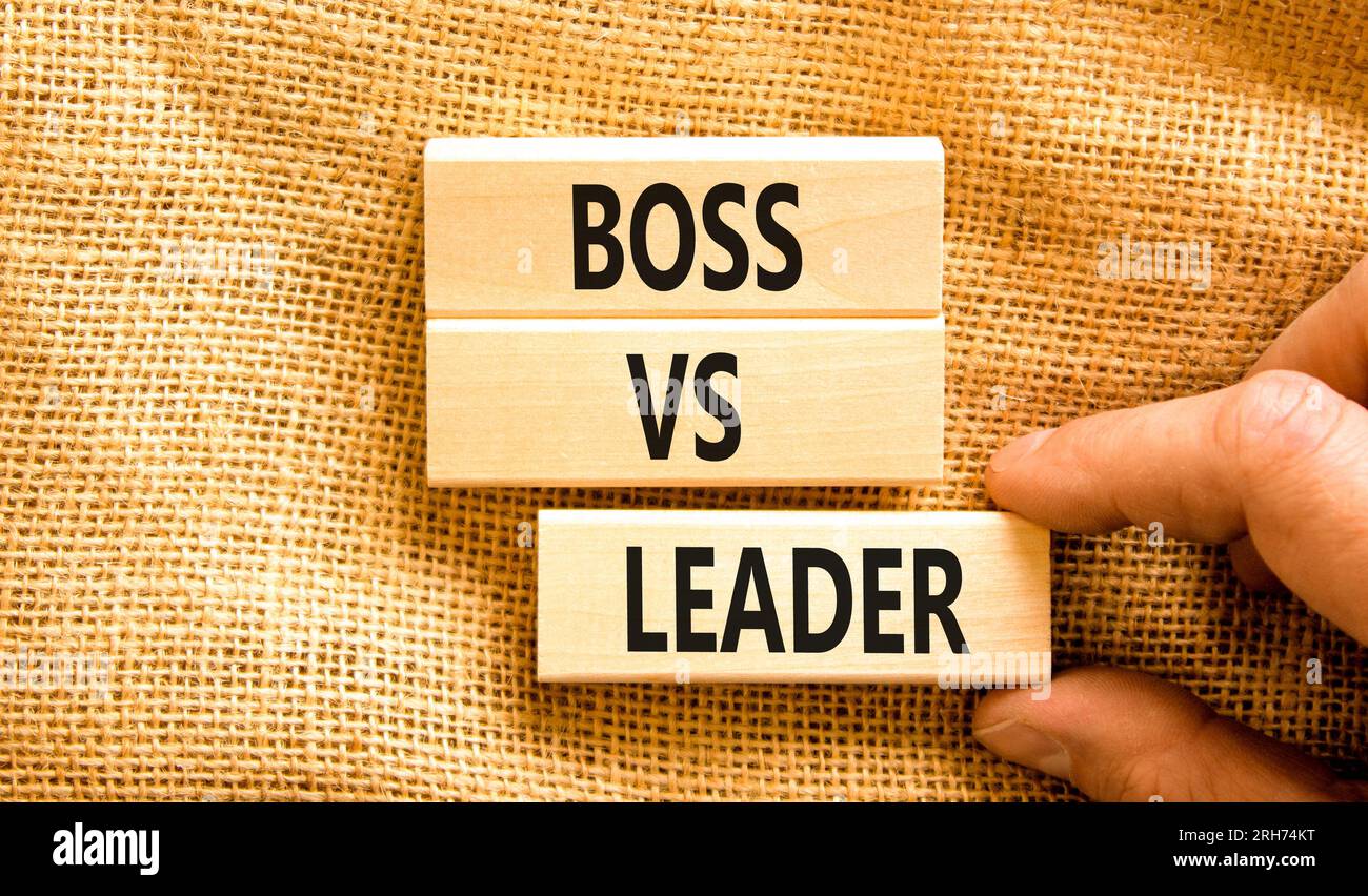 Boss vs leader symbol. Concept words Boss vs versus leader on wooden ...