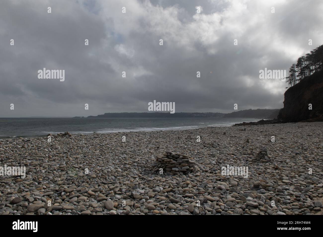 Pile of stones on Amroth Beach, Pembrokeshire, Wales Stock Photo - Alamy