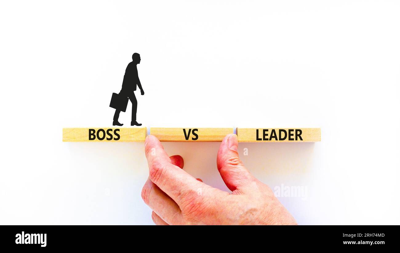 Boss vs leader symbol. Concept words Boss vs versus leader on wooden ...