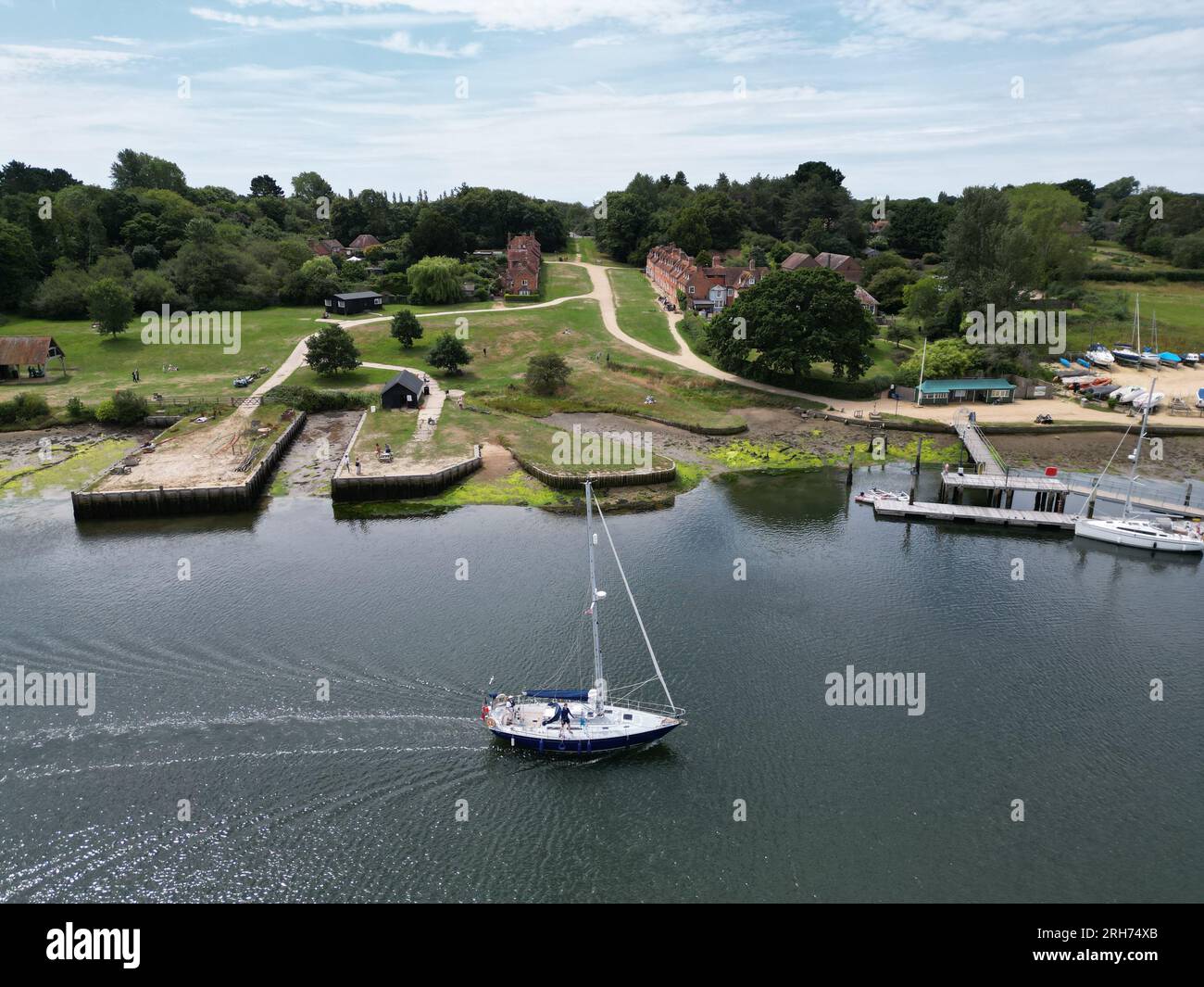 Yacht passing Bucklers hard Hampshire Historic ship building Village UK ...