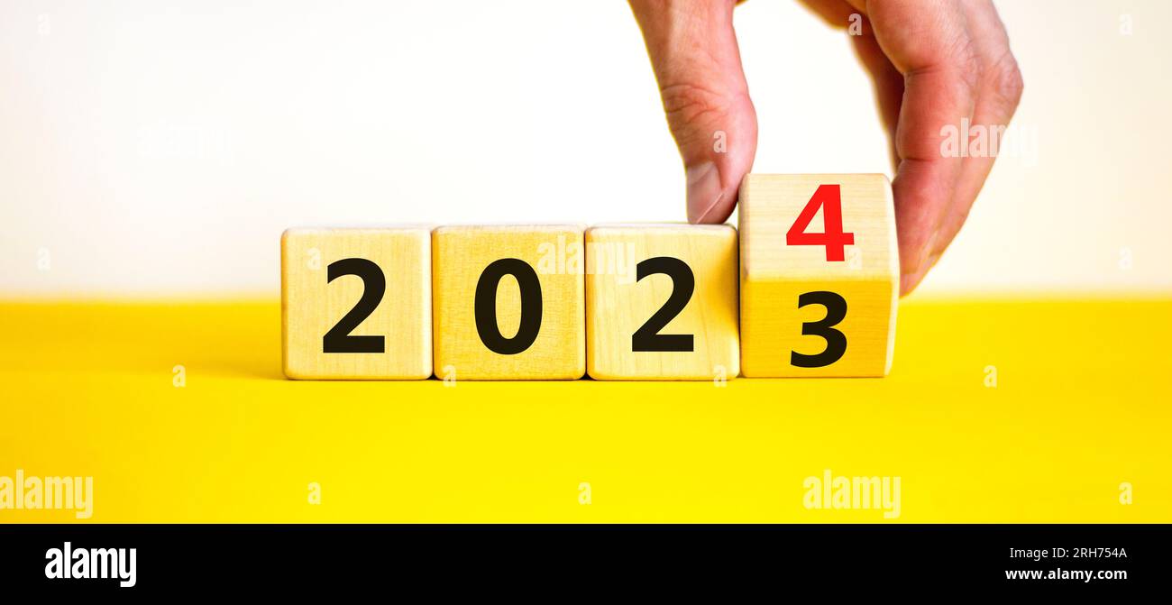 2024 happy new year symbol. Wooden cubes with number 2023 and 2024 ...