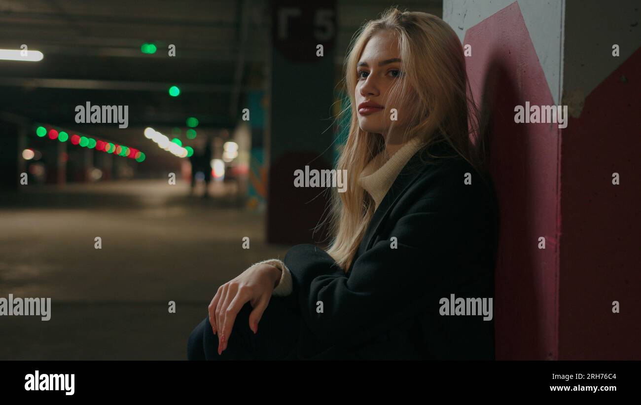Stressed Caucasian woman female victim hiding alone in underground ...