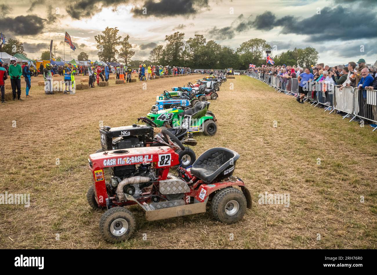 Drivers line up opposite their racing lawn mowers ready for the Le Mans style start of the ...