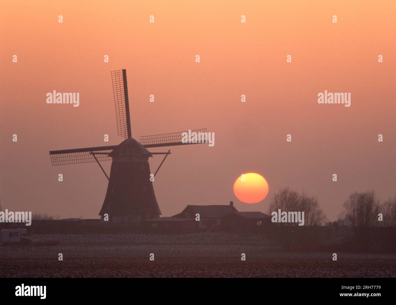 Traditional Dutch windmill at sunset, Holland, Netherlands., Europe ...