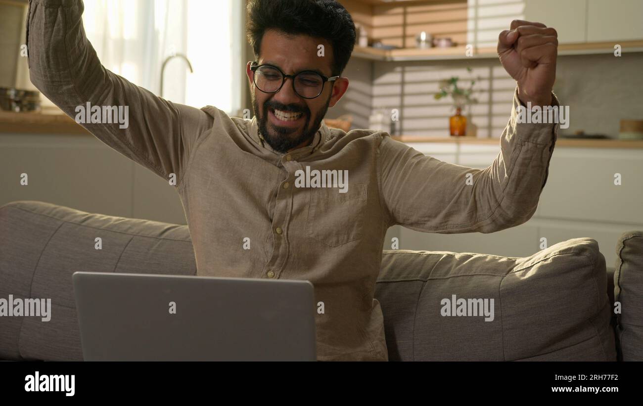 Excited shocked arabian indian businessman hi-res stock photography and ...