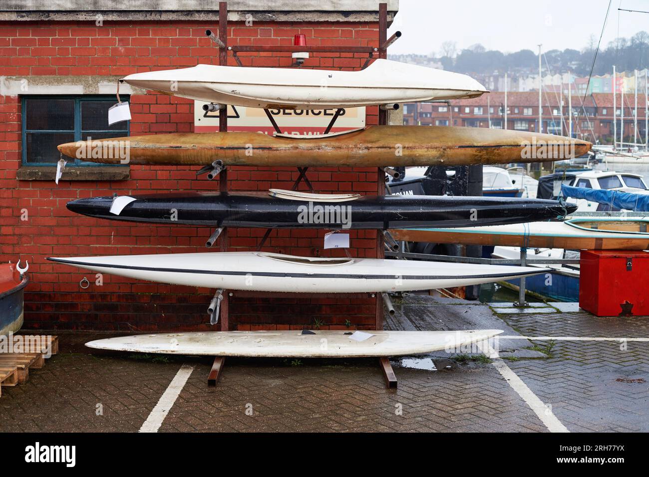 Kayak rental. Old kayaks on the rack Stock Photo - Alamy