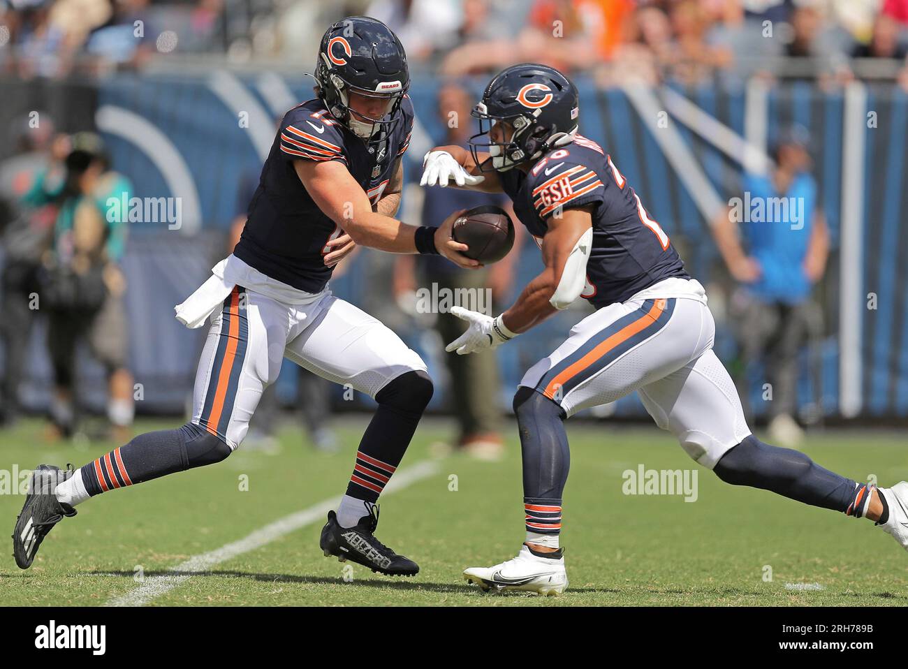 Chicago Bears quarterback Tyson Bagent (17) hands the ball off to ...