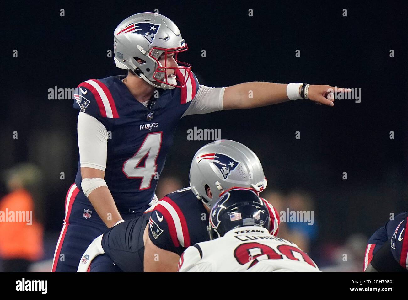 New England Patriots quarterback Bailey Zappe (4) on the line of ...