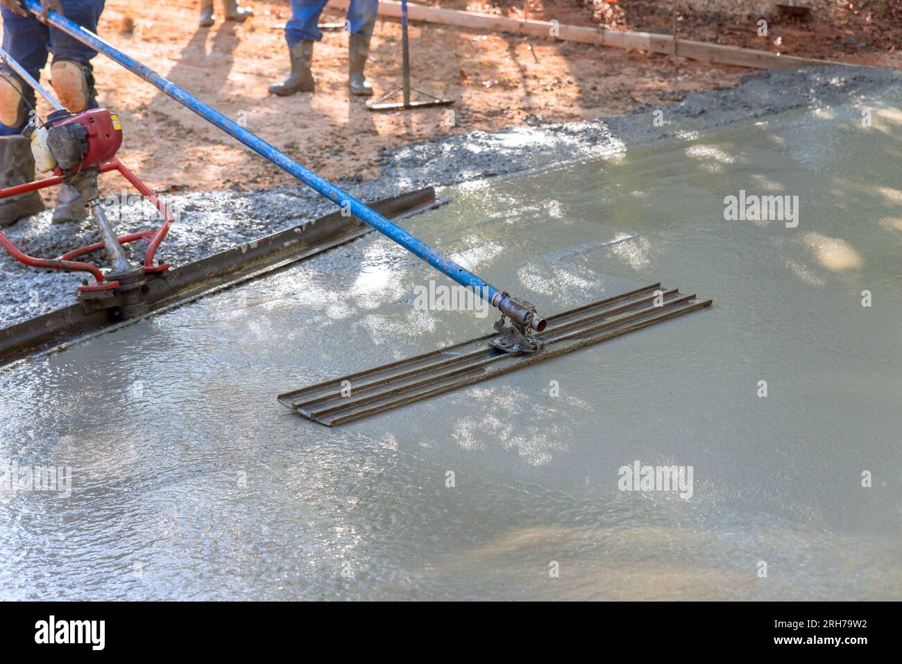 Leveling freshly poured concrete hi-res stock photography and images ...