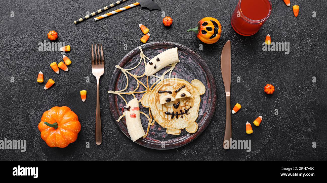 Funny Halloween food for kids on black background Stock Photo - Alamy