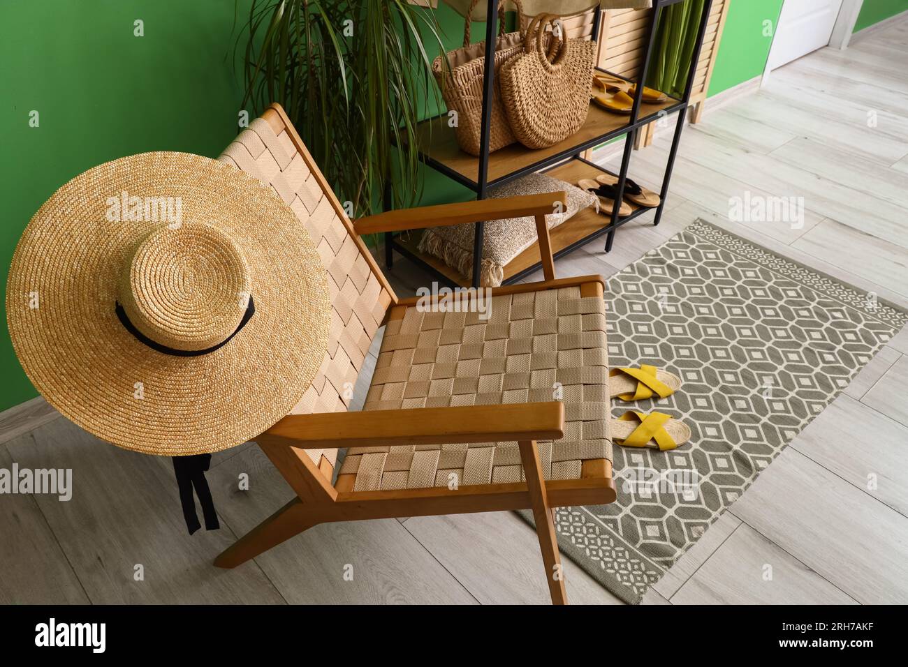 Interior of dressing room with shelving unit, clothes and armchair ...