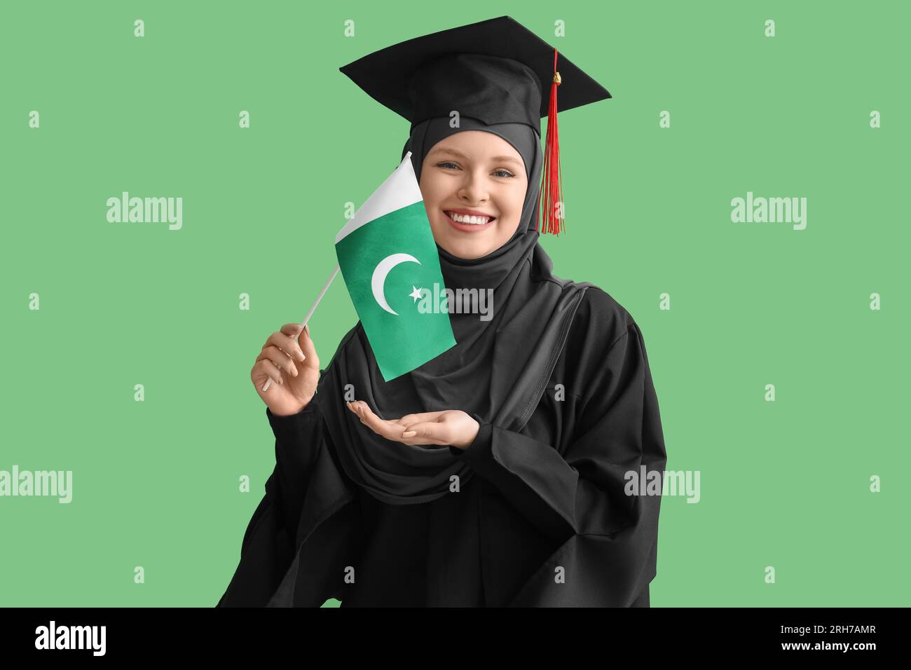 Islamic graduate student with flag of Pakistan on green background ...