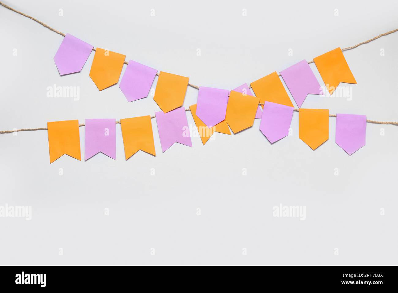 Garlands made of paper flags for Halloween celebration on white ...