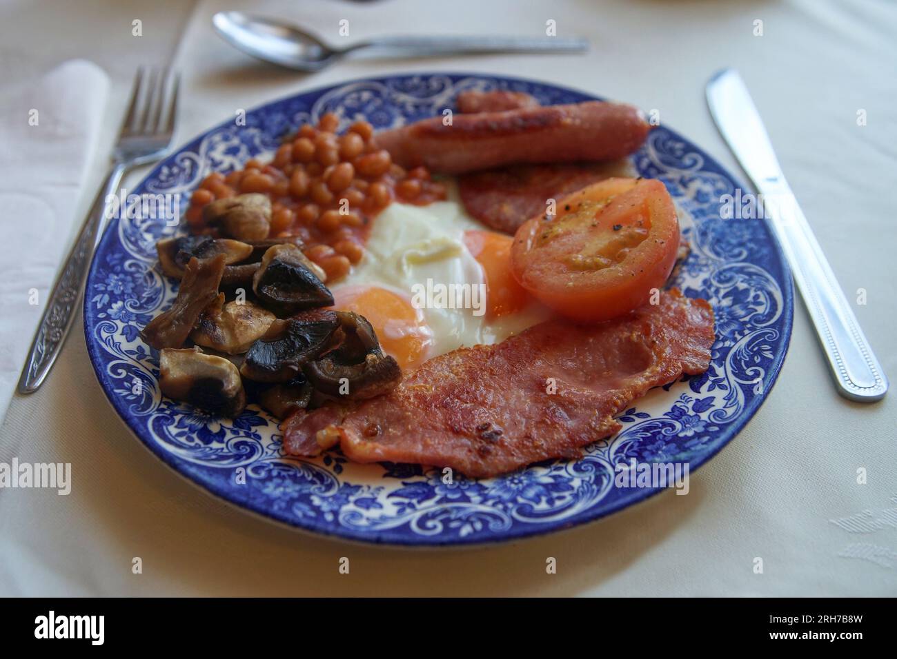 Traditional Full English Breakfest. Bacon, sausage, beans, mushroom ...