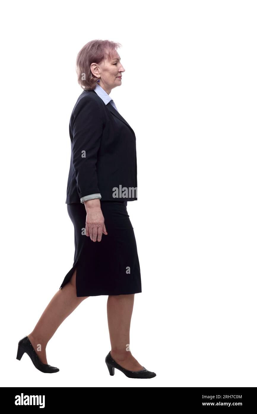 Mature business woman stepping forward. isolated on a white Stock Photo ...