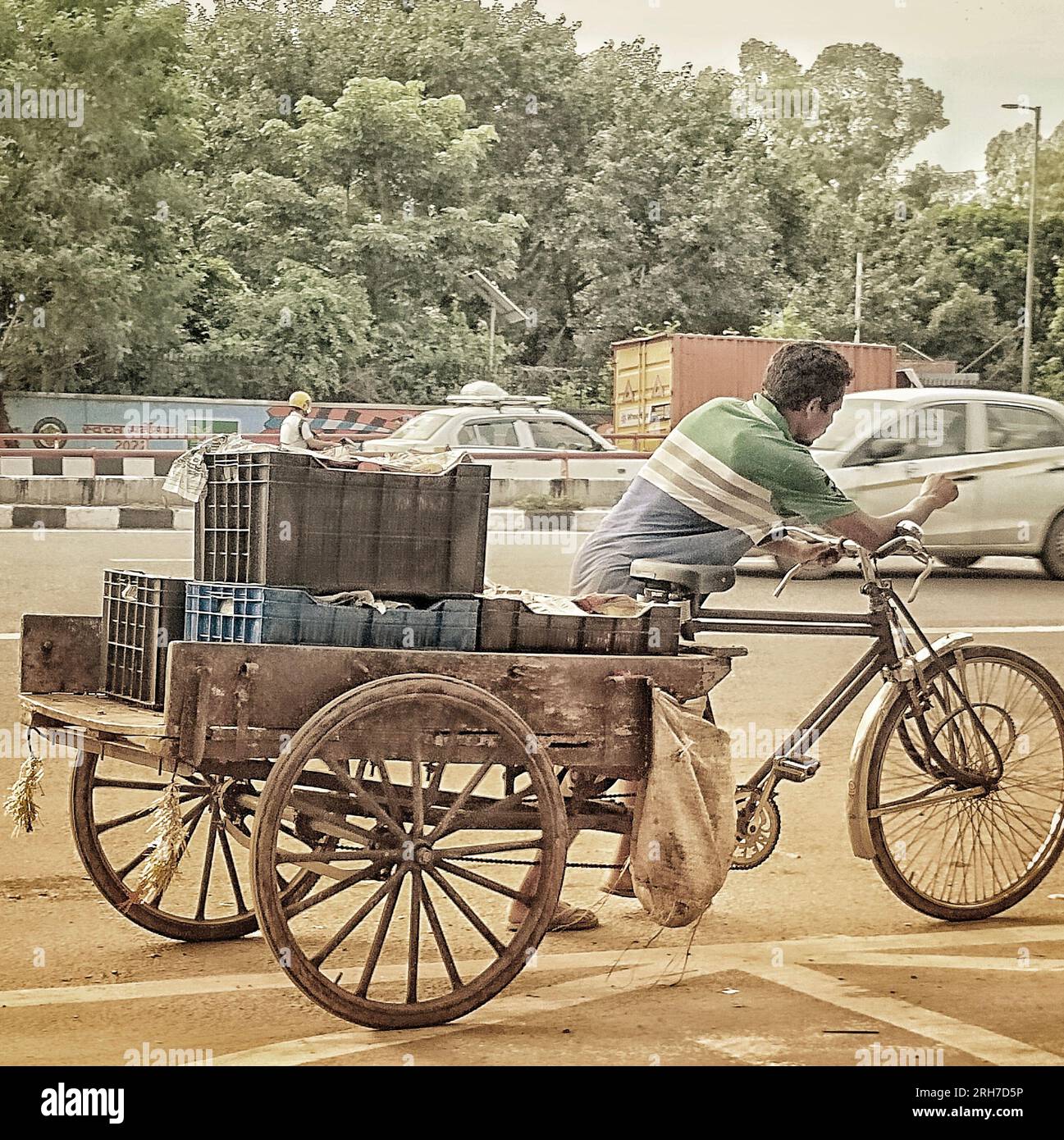 A man pushing a cart outside the Balukhali refugee camp. Approximately ...