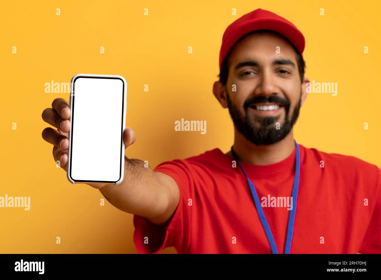 Indian Courier Guy Showing Smartphone With Blank Screen, Recommending ...