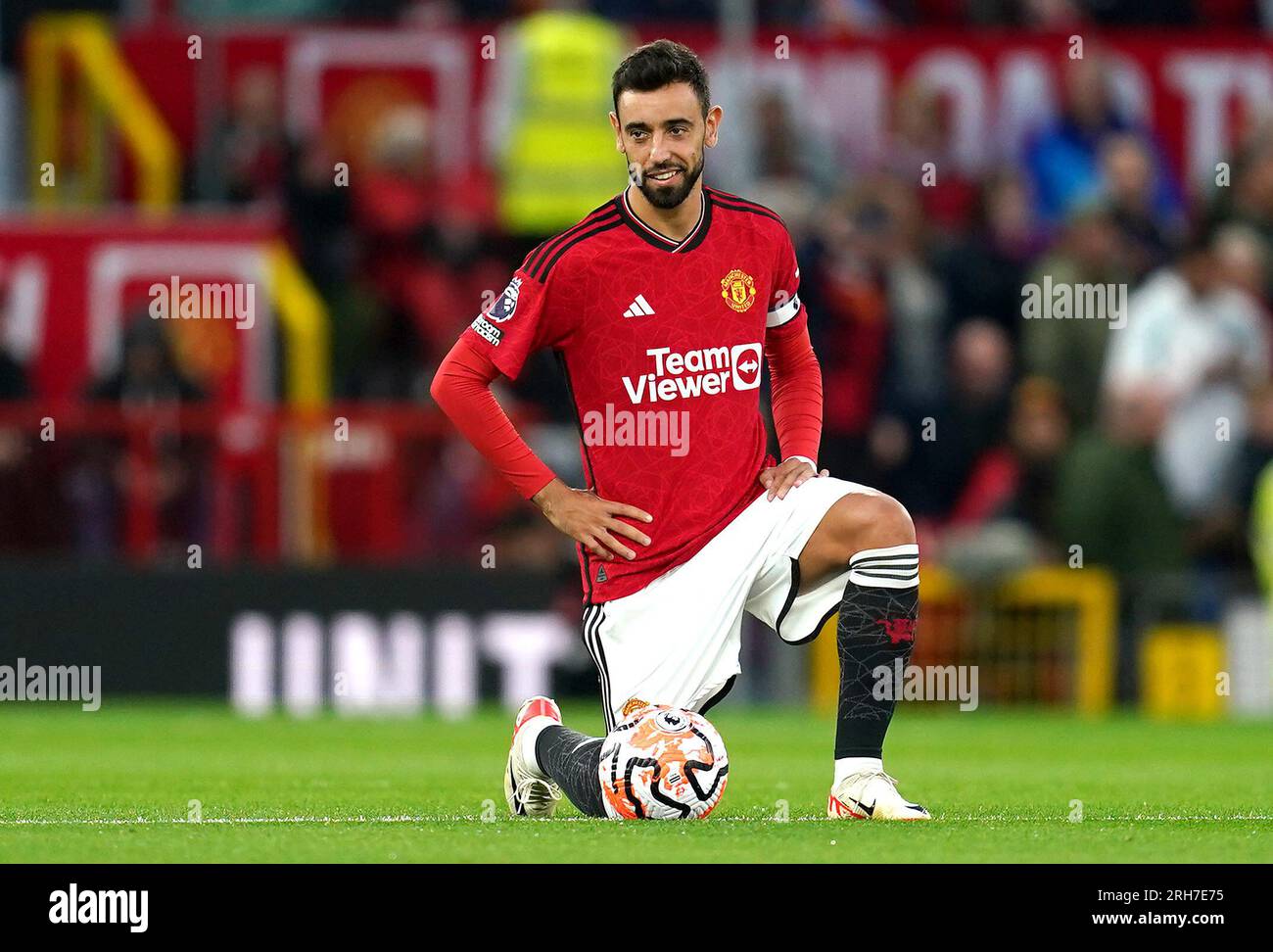 Manchester United's Bruno Fernandes takes a knee before the Premier ...