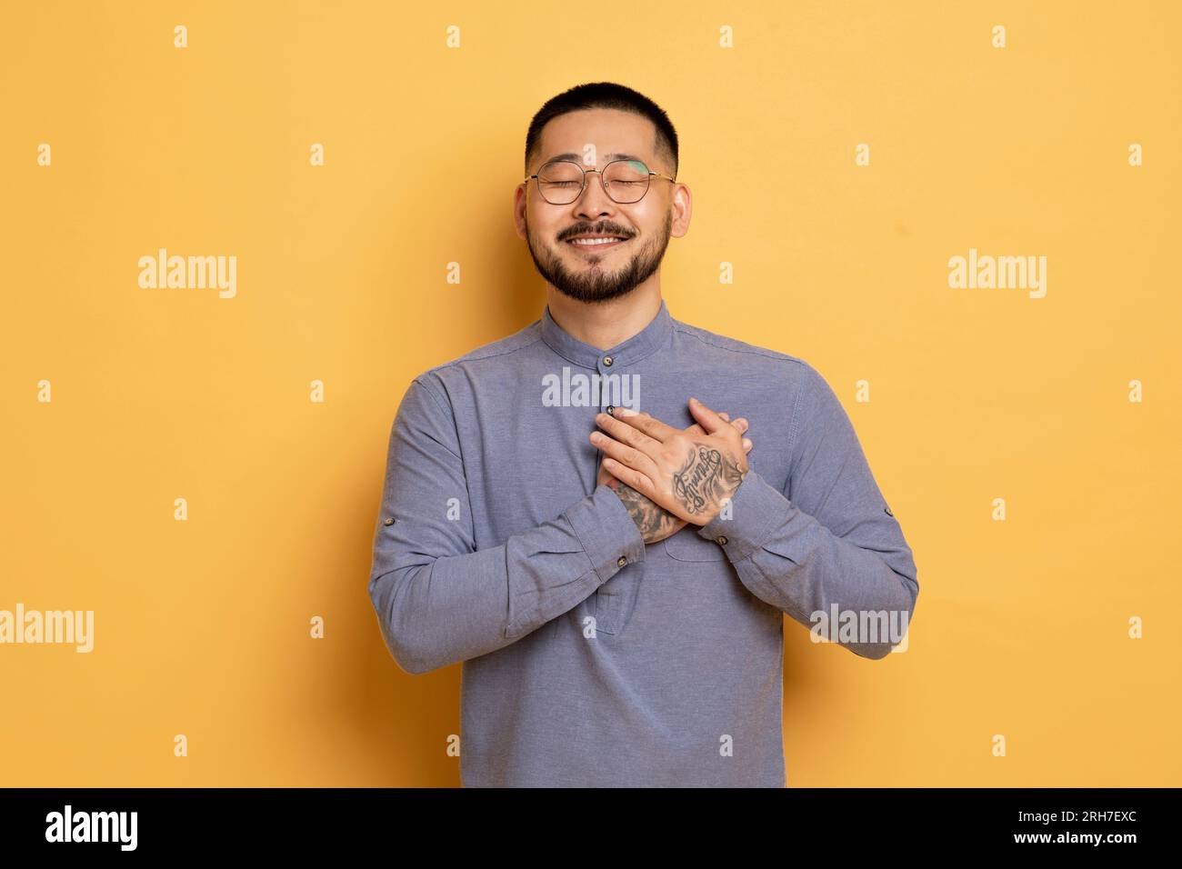Positive asian guy keeping hi-res stock photography and images - Alamy