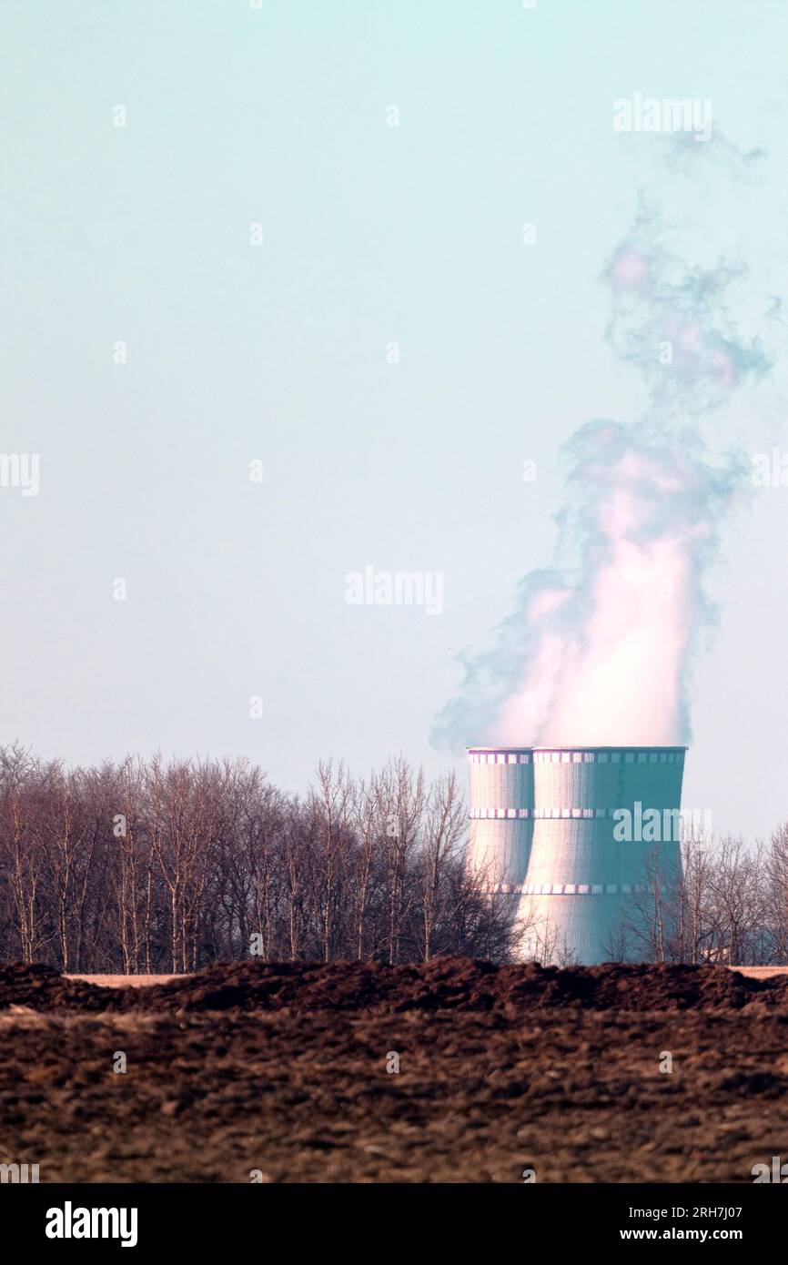 The cooling towers of a thermal power plant emit clouds of steam (a ...