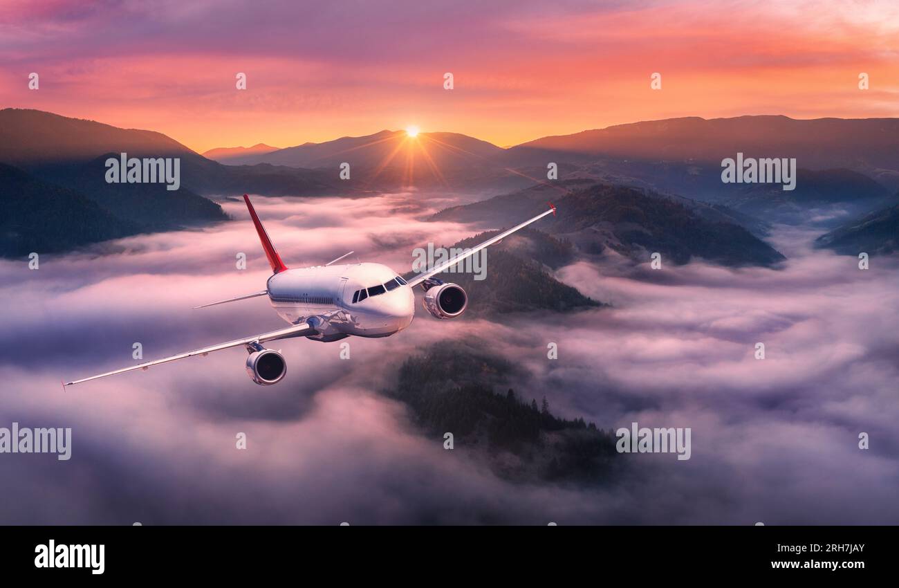 Aeroplane flying over mountain peak hi-res stock photography and images ...