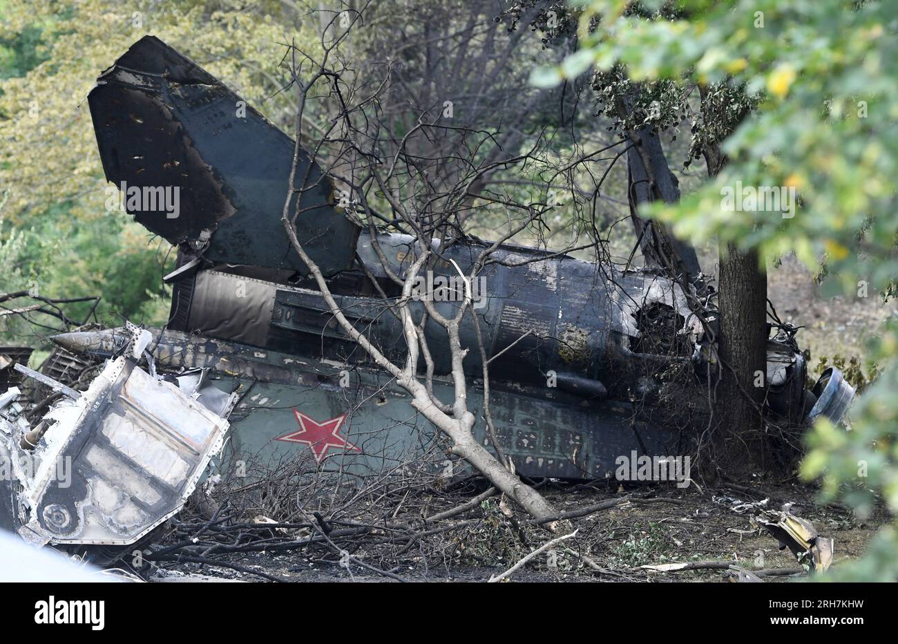 A destroyed MiG-23 fighter plane sits after crashing at an apartment ...