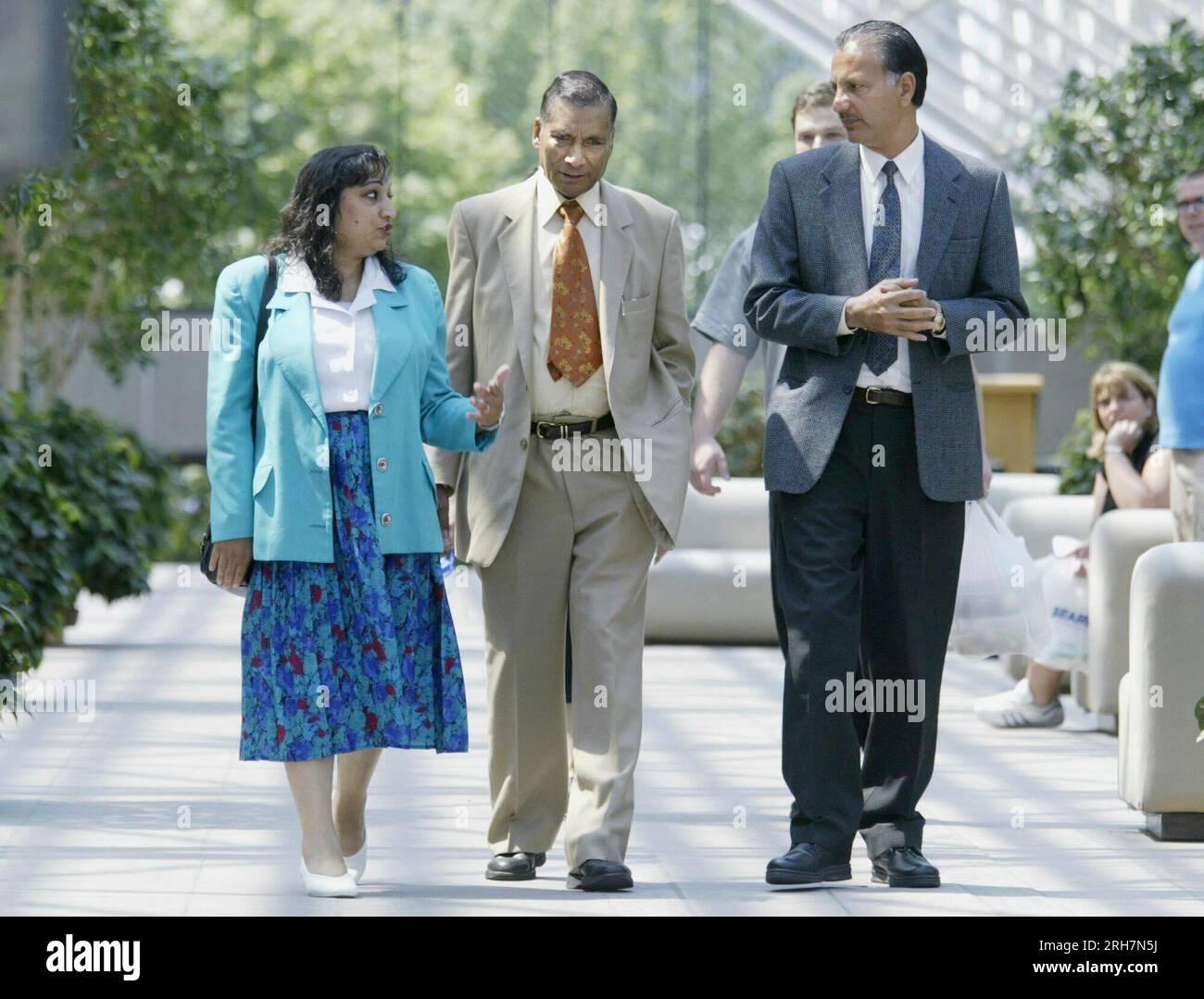 Reena Virk's parents Suman, left, and Manjit Virk, right, and her ...