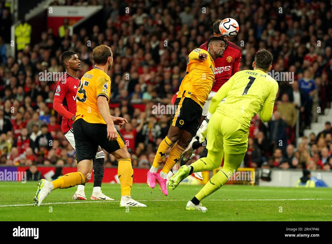 Manchester United's Raphael Varane (second right) scores their side's ...