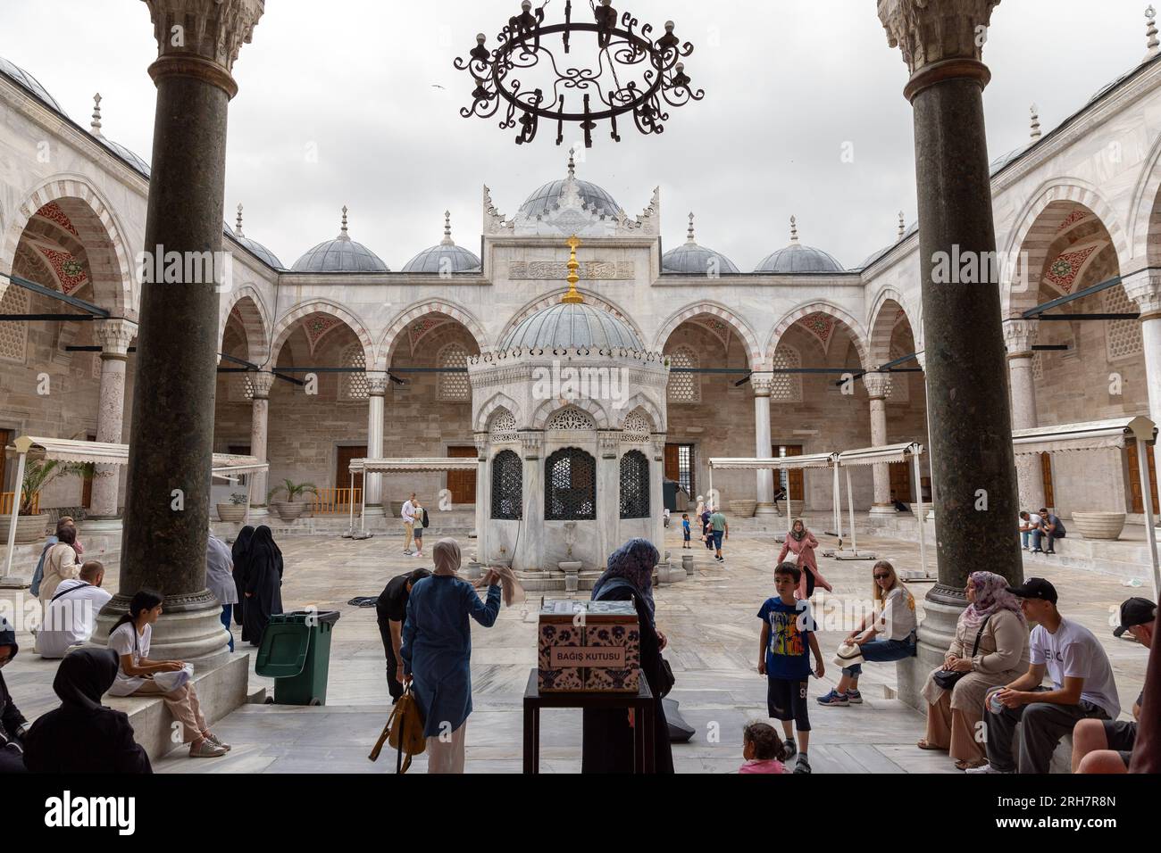 Istanbul, Turkey. August 14, 2023: Muslims and tourists in the outer ...