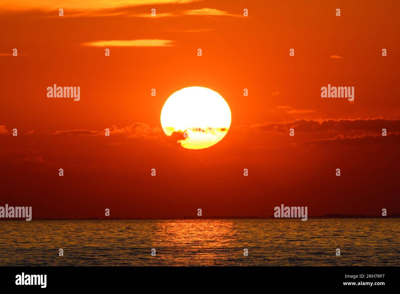 The sun sets over the Adriatic Sea off the coast of Trieste, Italy ...